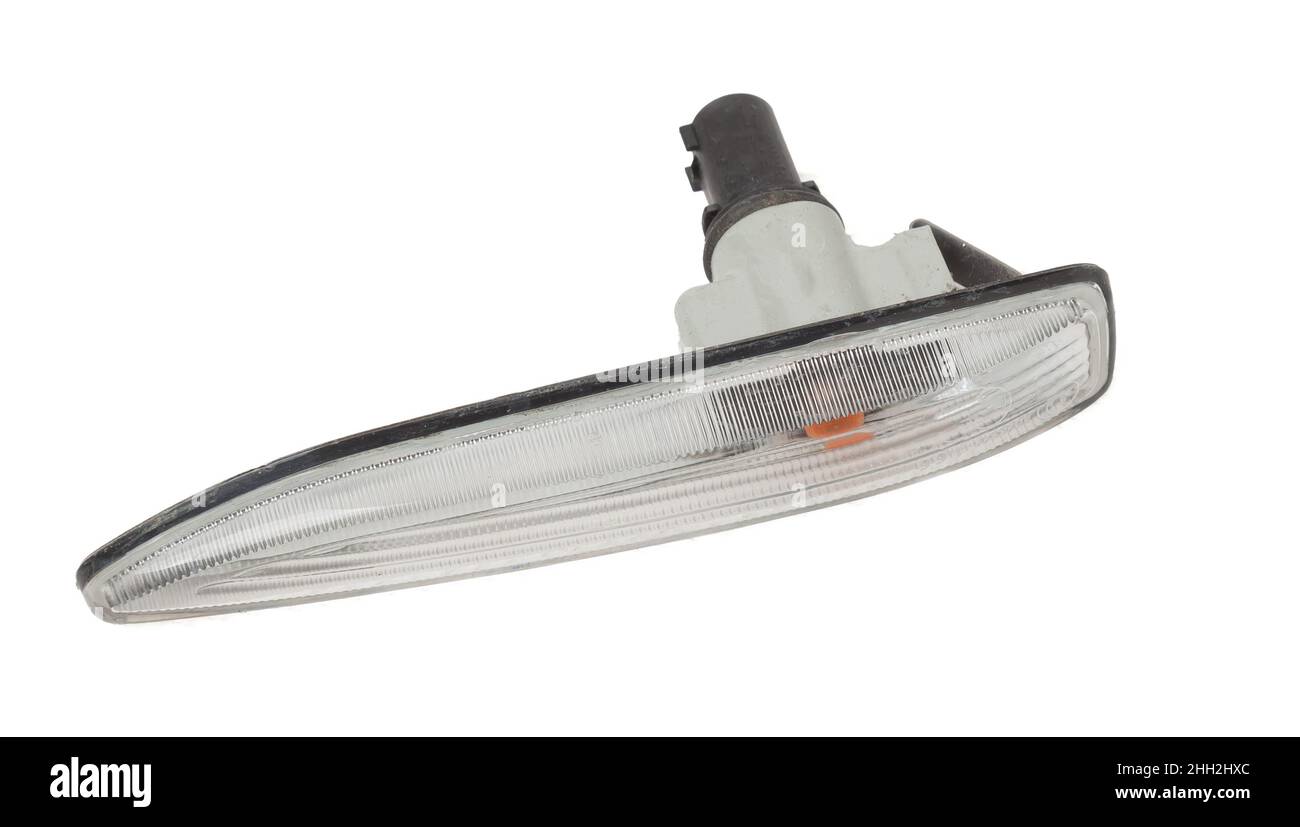 The details of the front turn signal of the white car. Turn lamp of the ...
