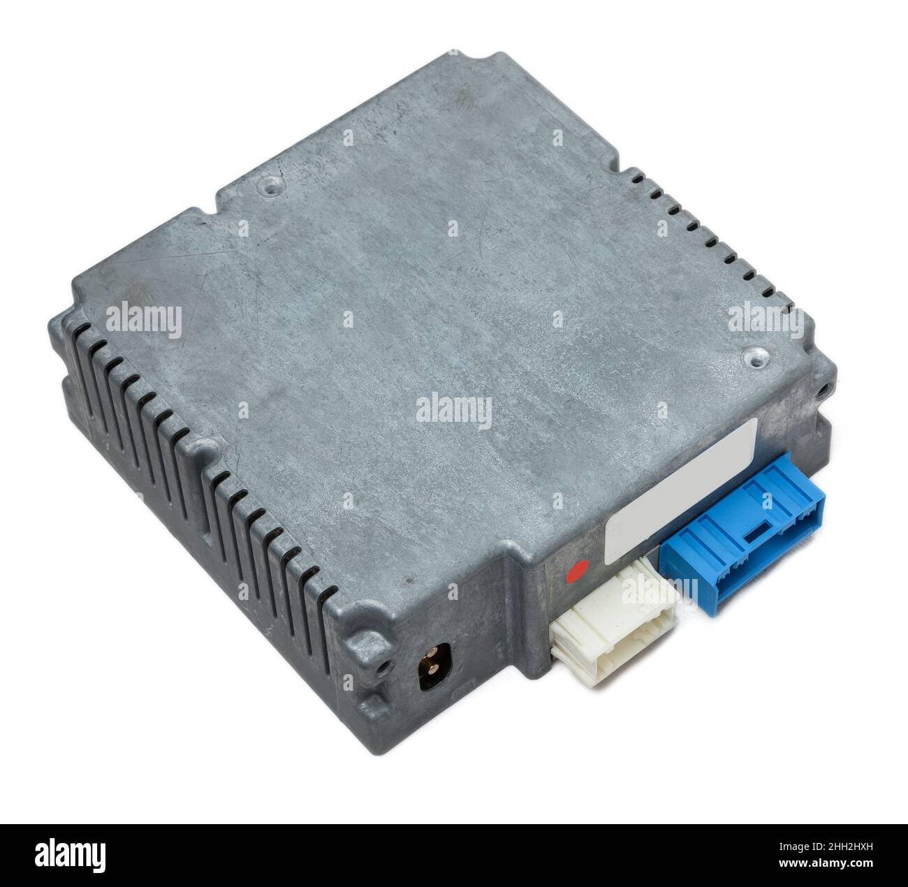 Metallic car engine control unit with plastic elements on a white ...