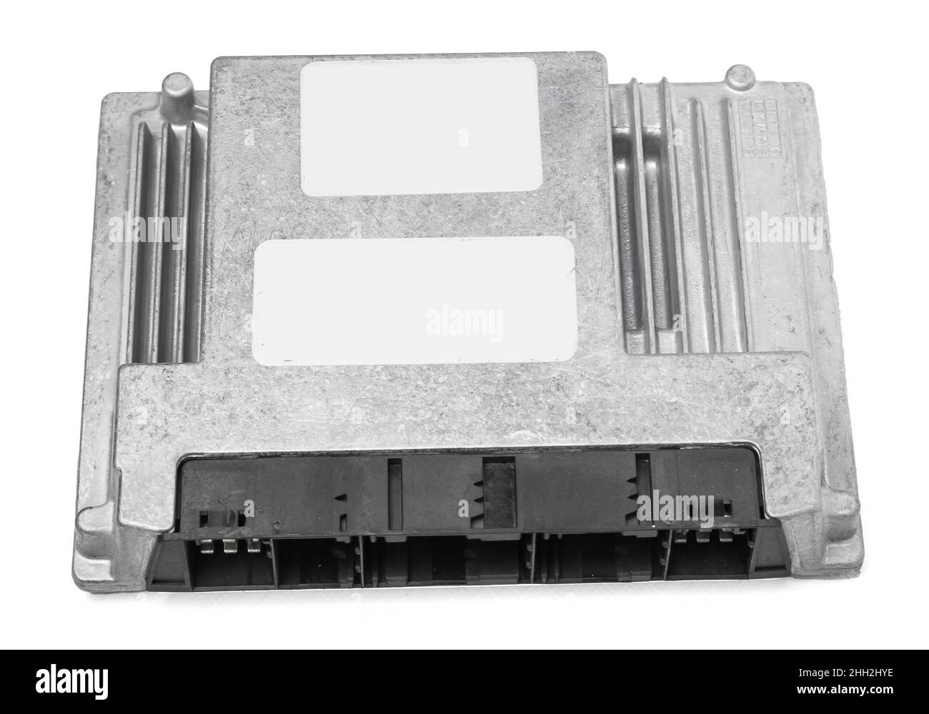 Metallic car engine control unit with plastic elements on a white ...