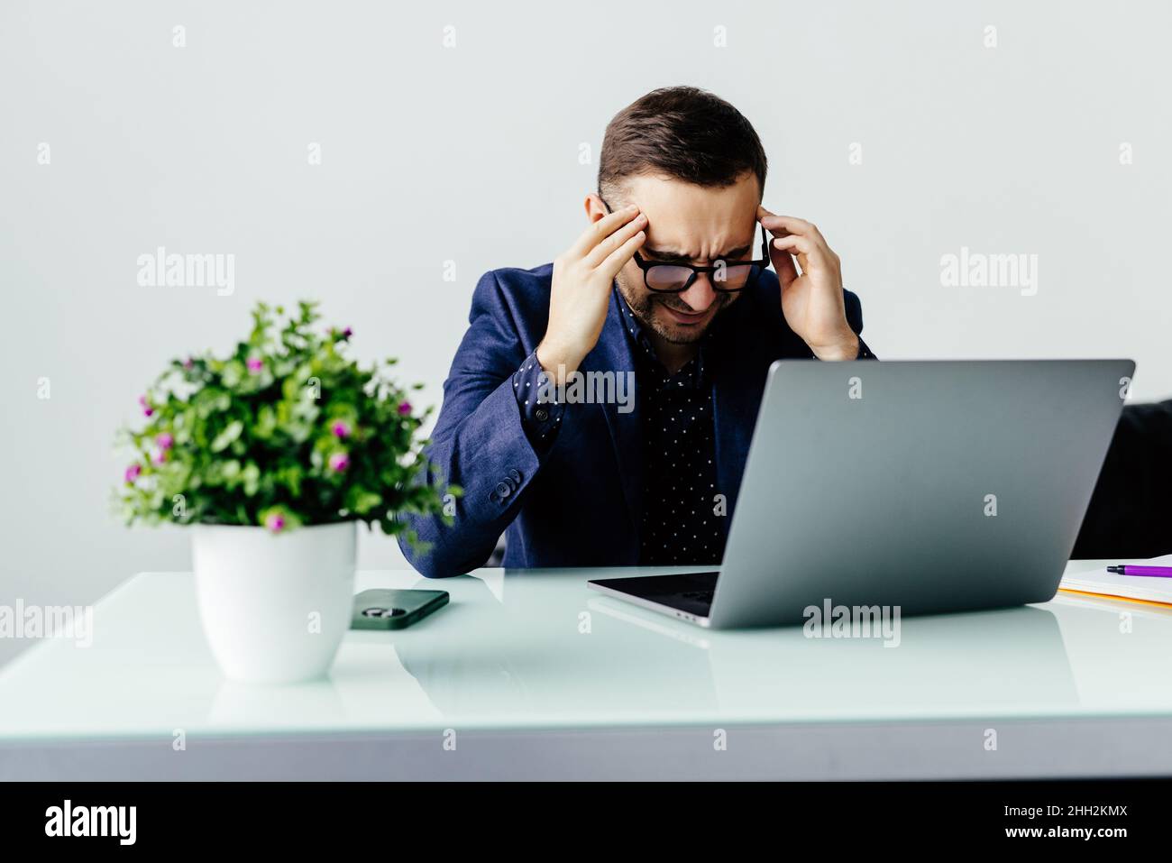 Feeling tired. Frustrated young handsome man looking exhausted while ...