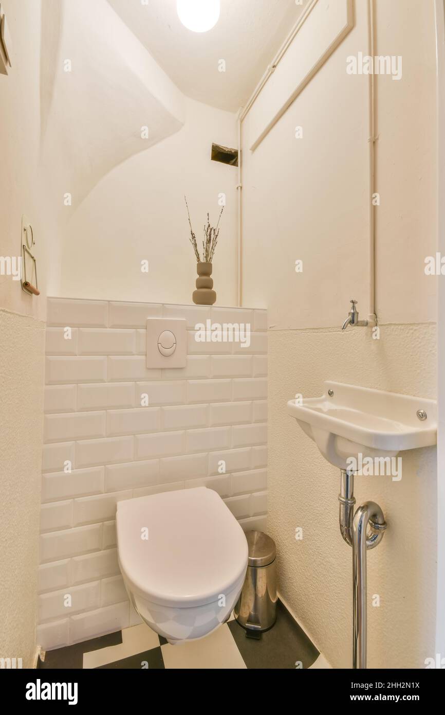 Interior of small clean restroom in miniature style Stock Photo - Alamy