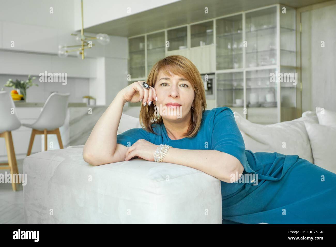 Calm relaxed beautiful mature woman resting indoor Stock Photo - Alamy