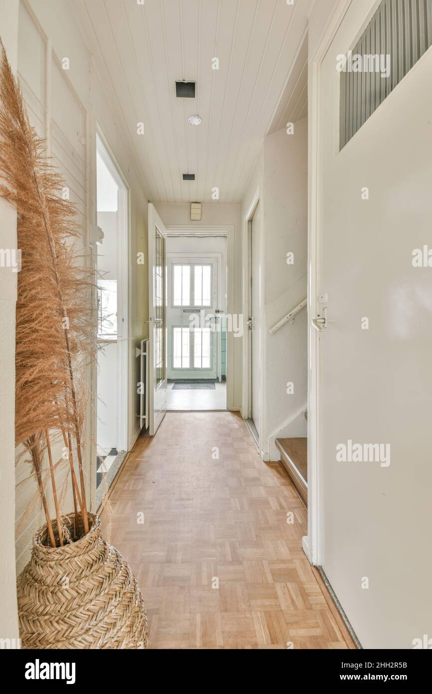 A long empty corridor designed in minimalistic style Stock Photo - Alamy