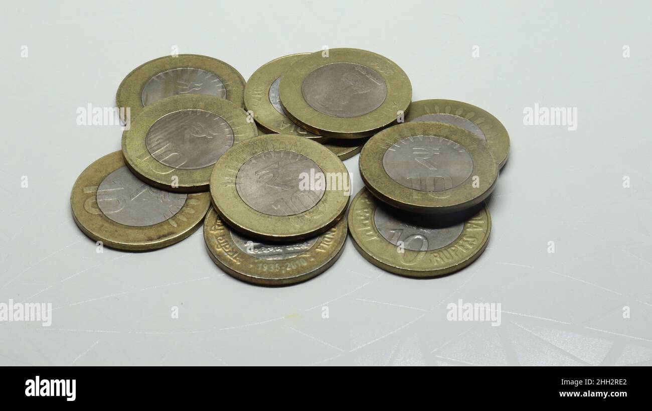 Pile of Indian Rupee Coins. Ten rupee pile coins. On a white background ...