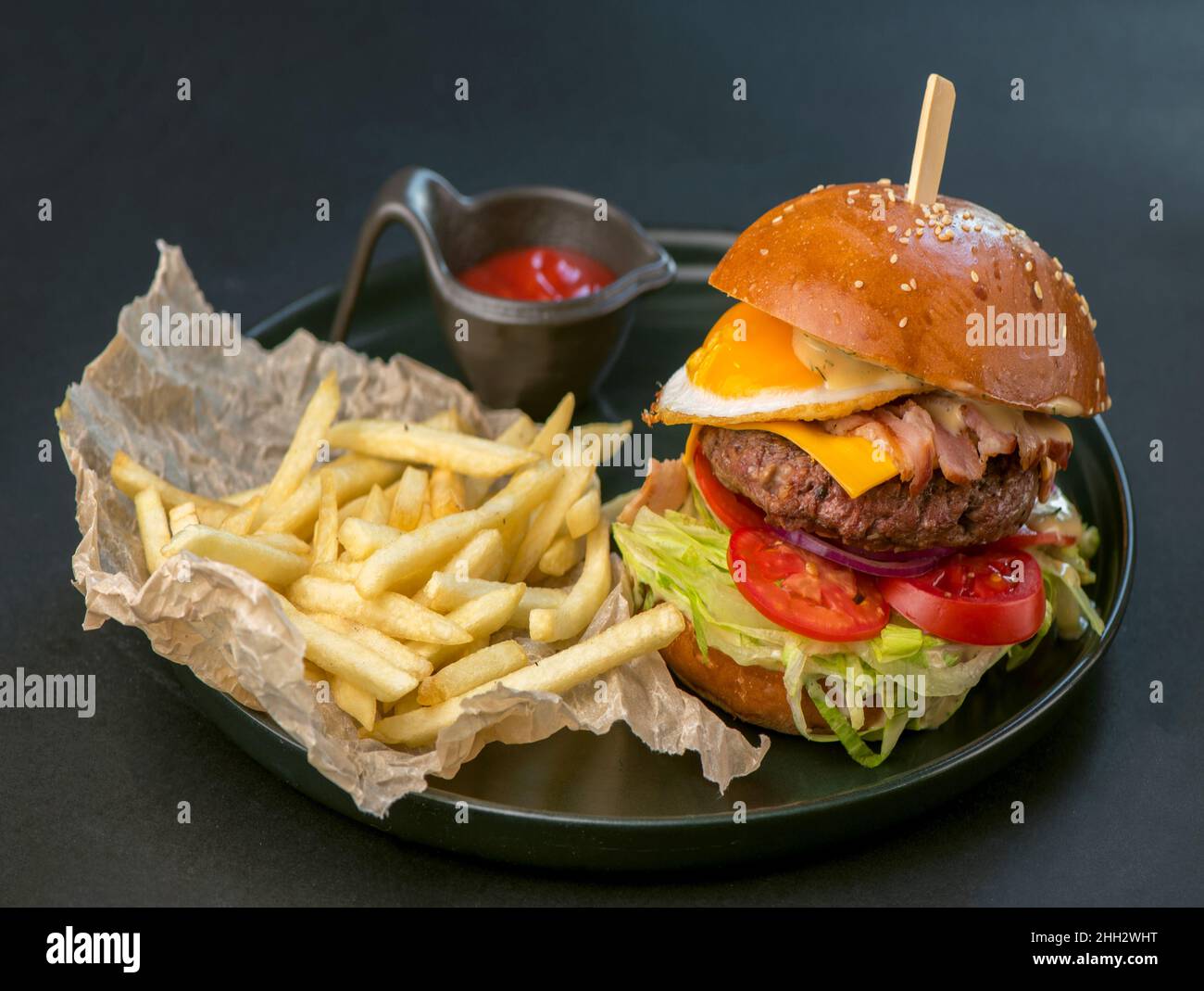 Delicious hamburger, hamburger with cutlet and scrambled eggs with ...