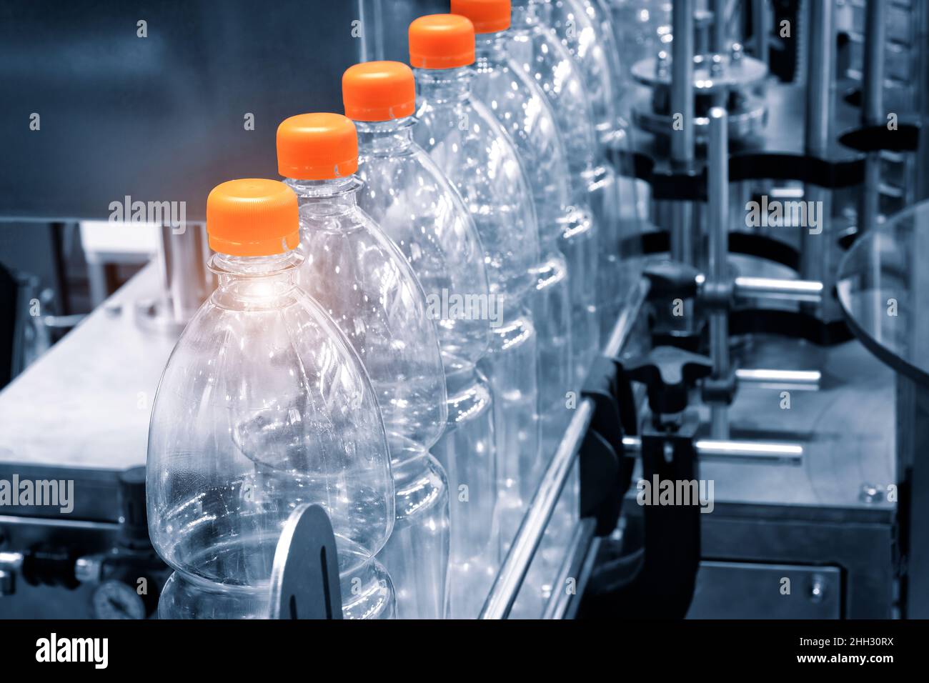 Conveyor line for the production of plastic bottles close-up Stock ...