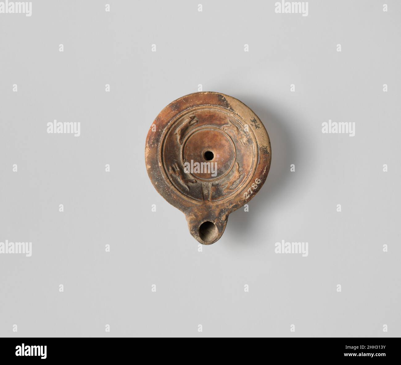 Terracotta oil lamp 2nd century A.D. Roman Mold-made. Deep, concave ...
