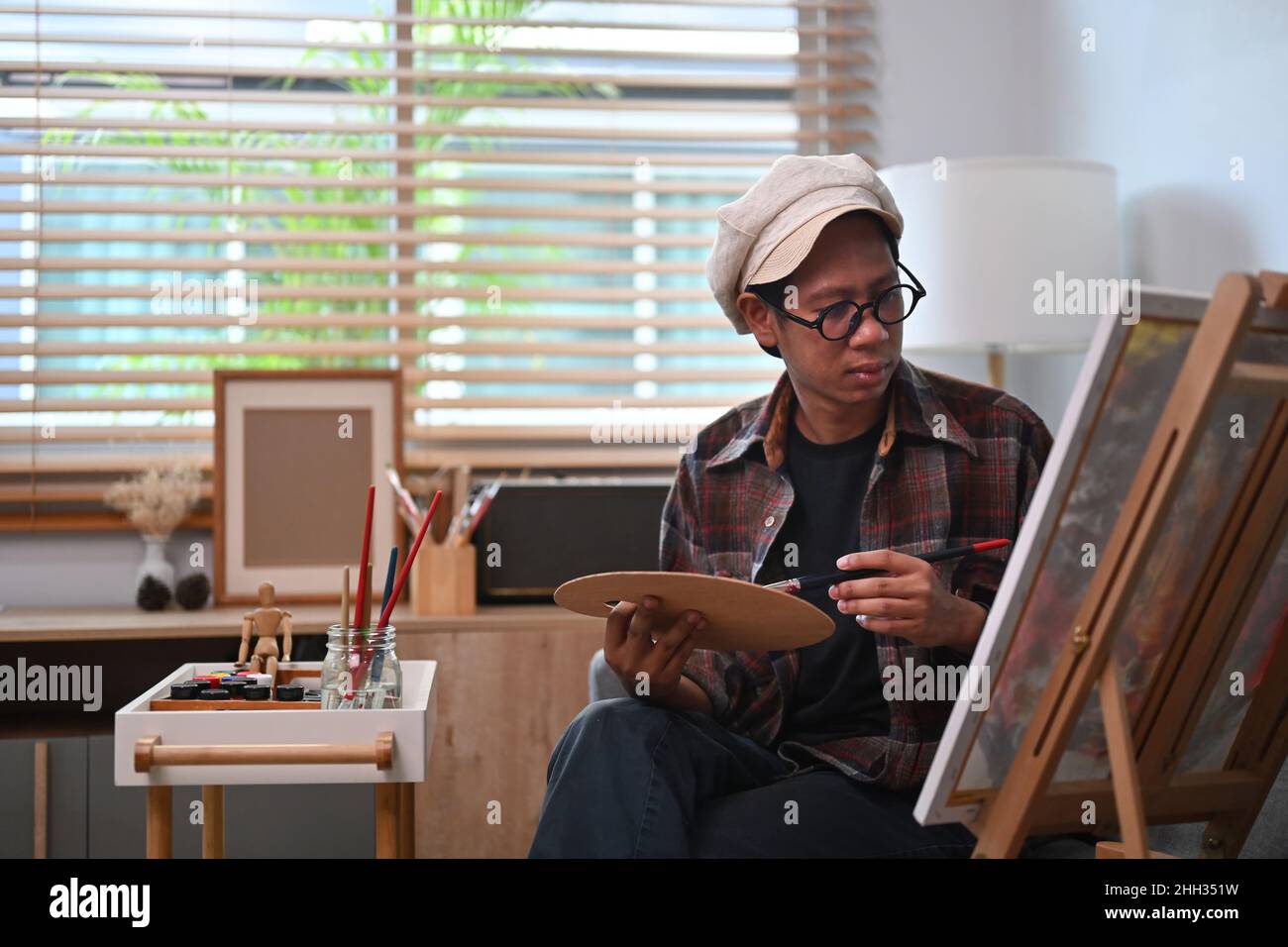 Talented male artist working on hi-res stock photography and images - Alamy