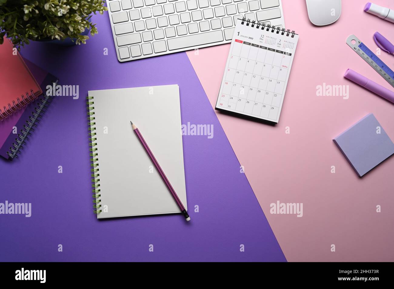 Top view notebook, calendar and stationery on purple background Stock ...