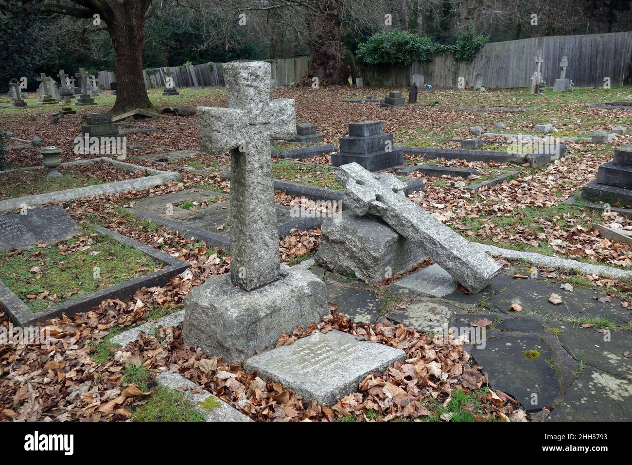 A Old Graveyard with Broken and Fallen Crosses and Graves in Overgrown Grass Spooky Stock Photo ...