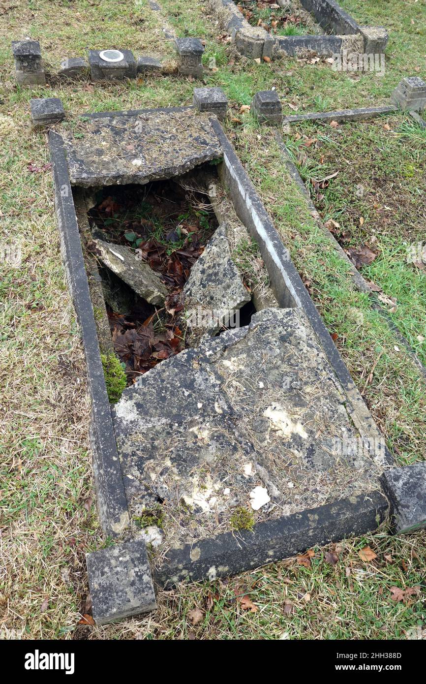 A Old Graveyard with Broken and Fallen Crosses and Graves in Overgrown Grass Spooky Stock Photo ...