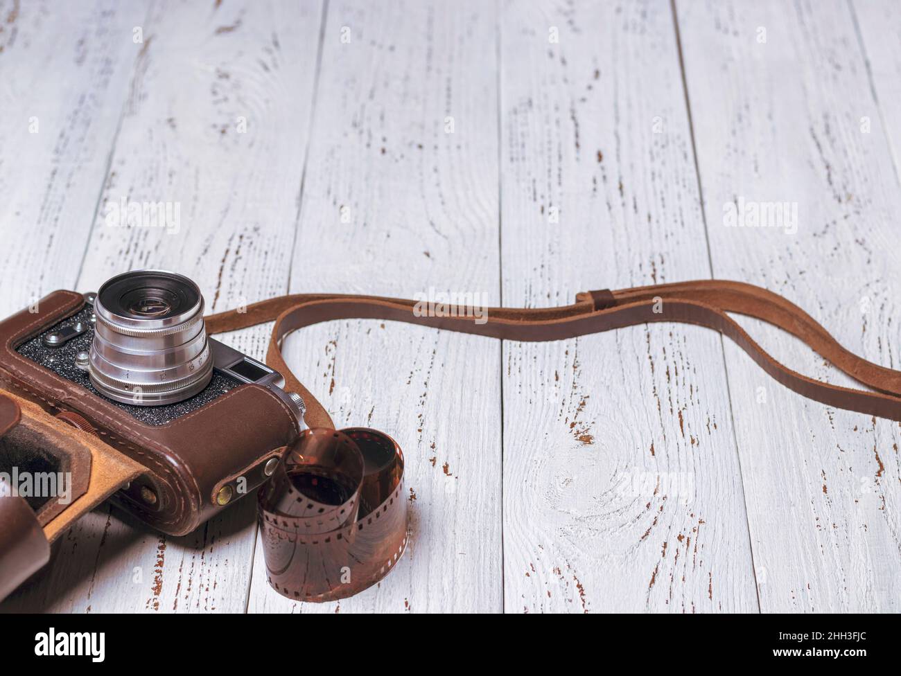 An old retro camera in a brown leather case with film. Vintage photo ...