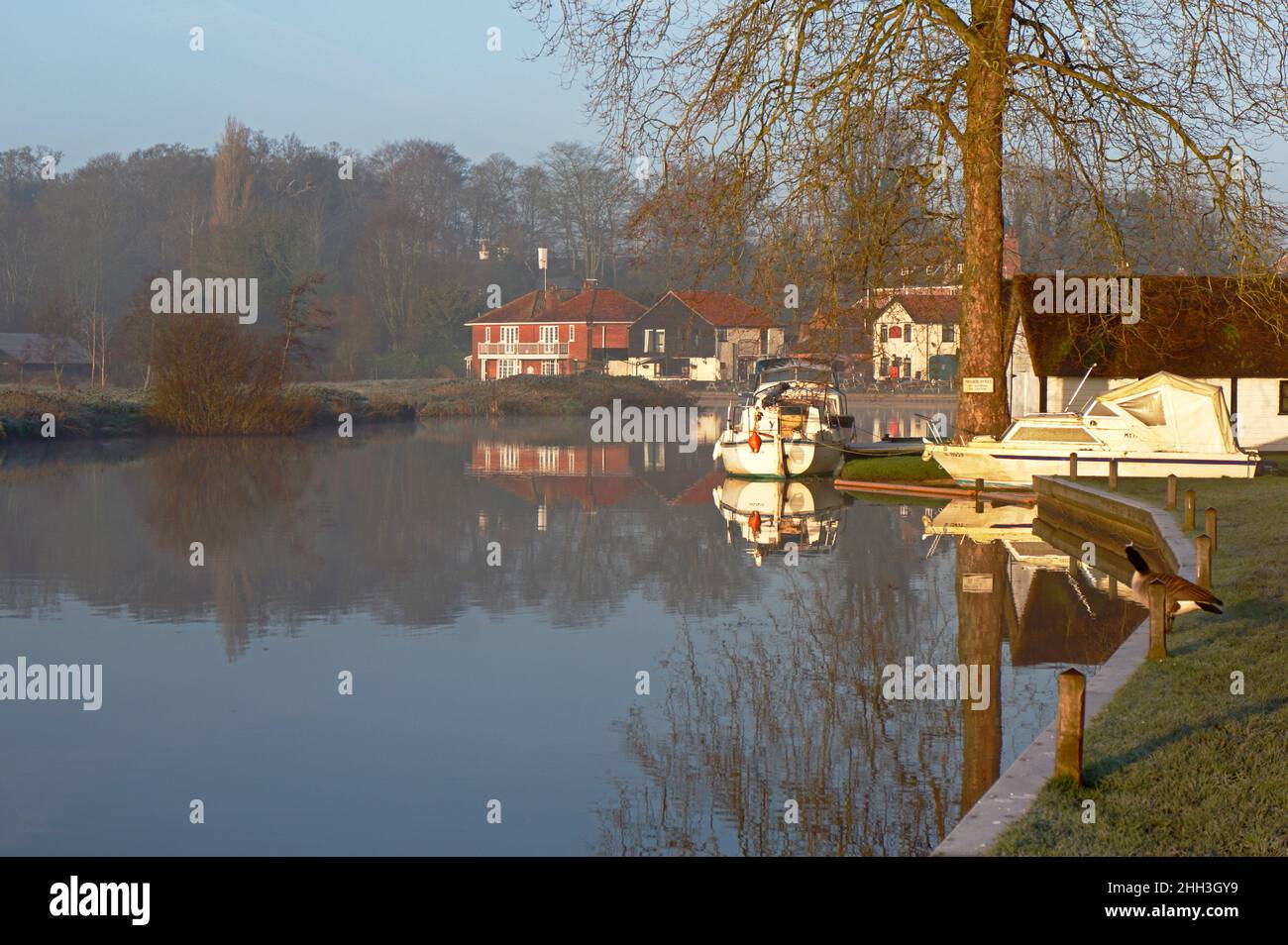 Early morning mist clearing on the River Bure on the Norfolk Broads ...