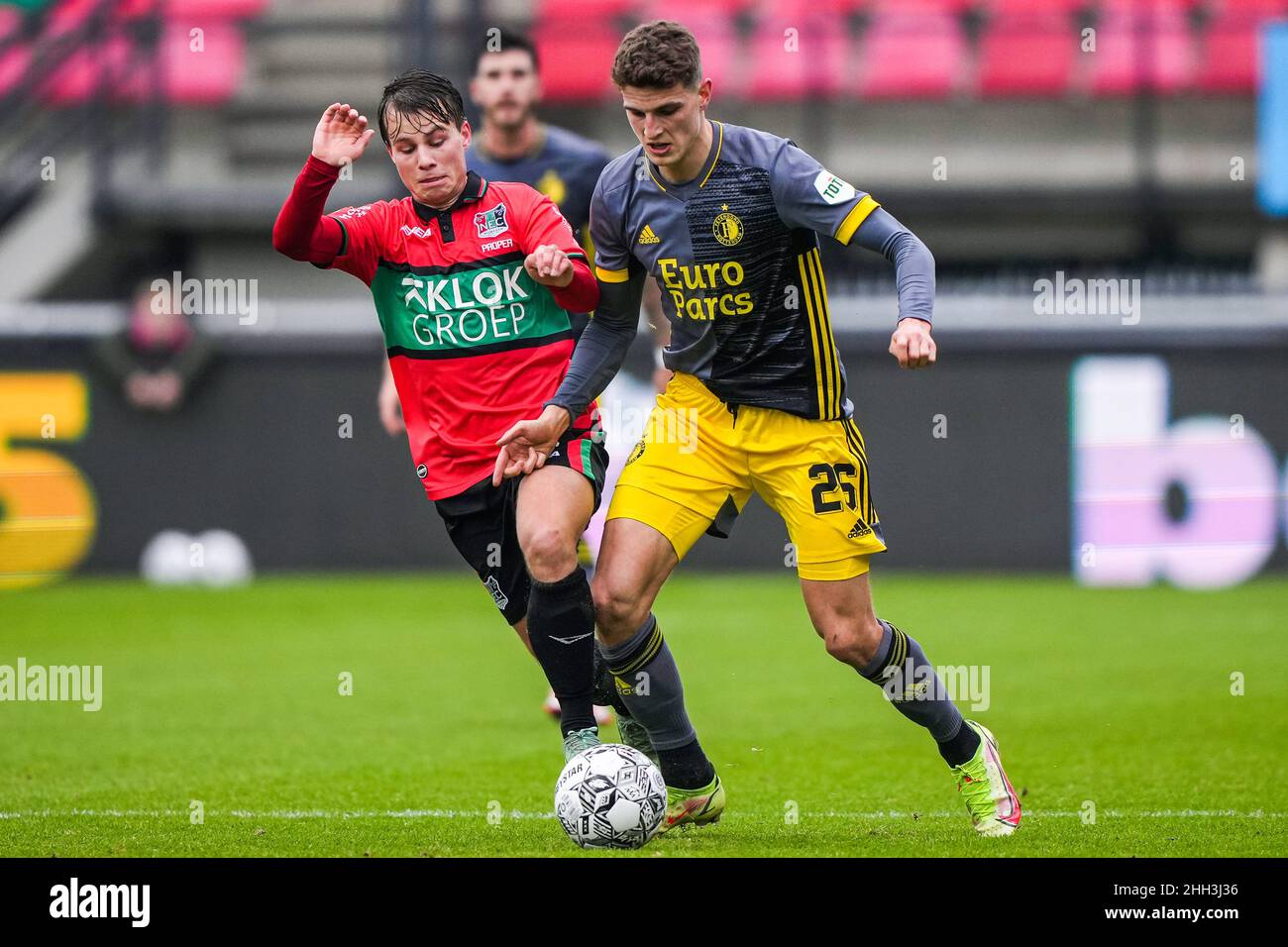 Nijmegen - Dirk Proper of NEC, Guus Til of Feyenoord during the match ...
