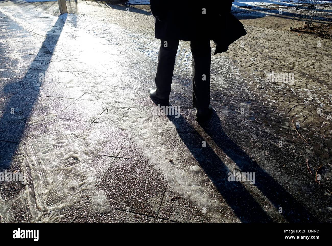 Black ice on a sidewalk in Berlin Stock Photo - Alamy