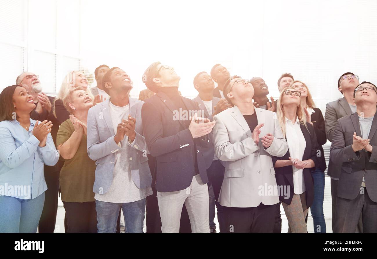 Business leaders with team of employees looking up Stock Photo - Alamy