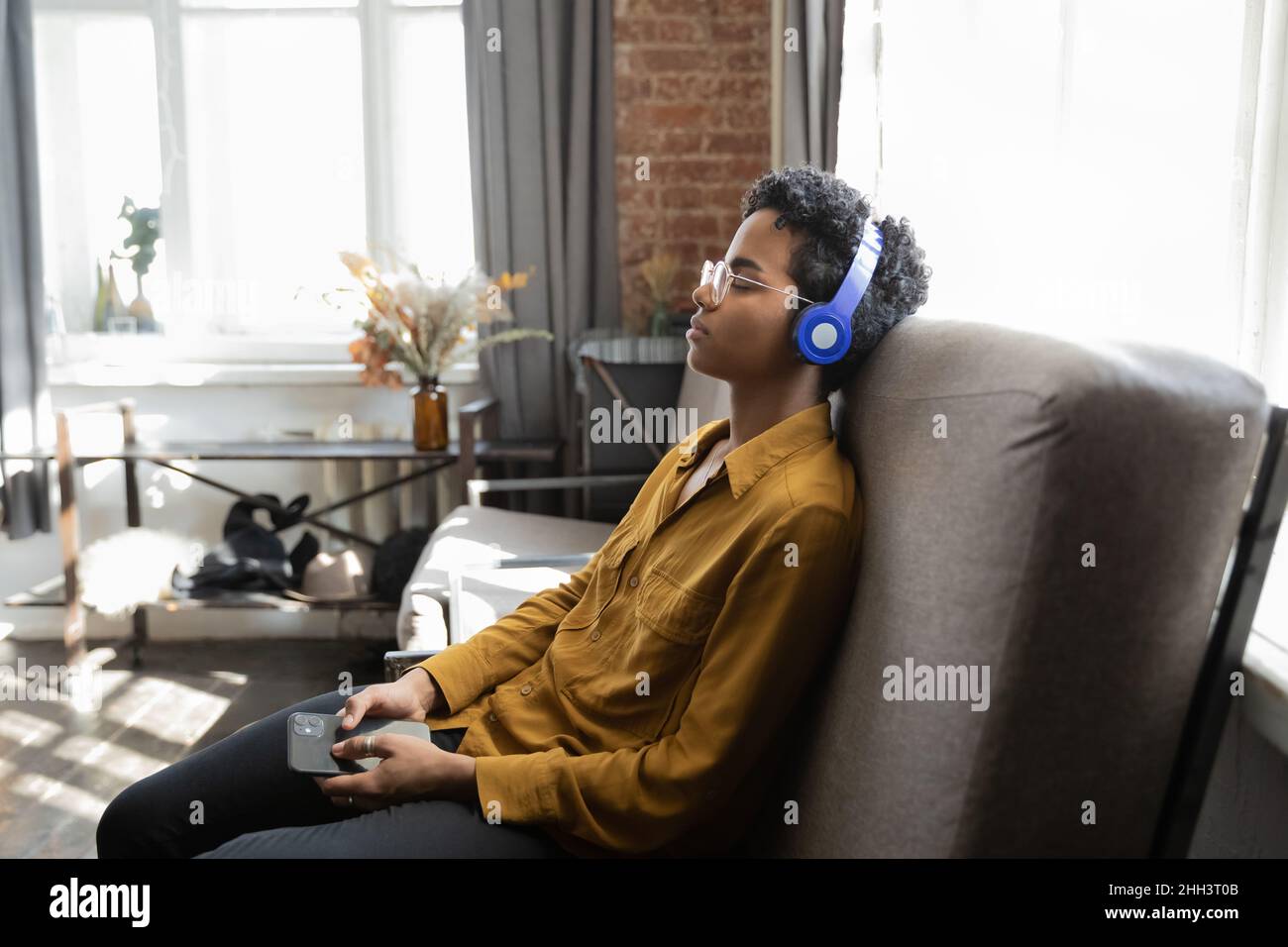 Peaceful calm millennial Afro American woman taking pause Stock Photo ...