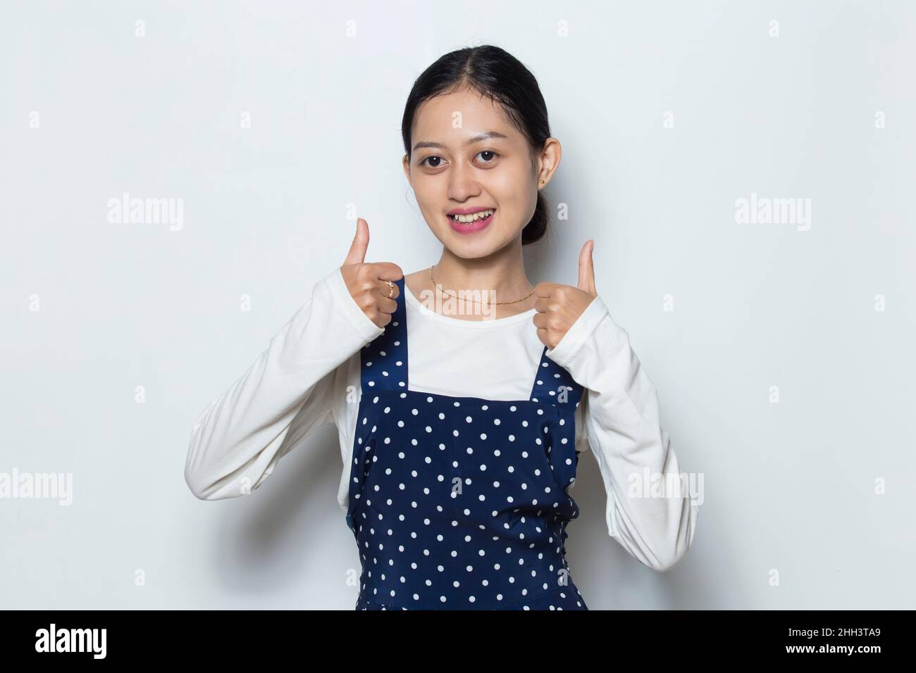 Asian woman with ok sign gesture tumb up Stock Photo - Alamy