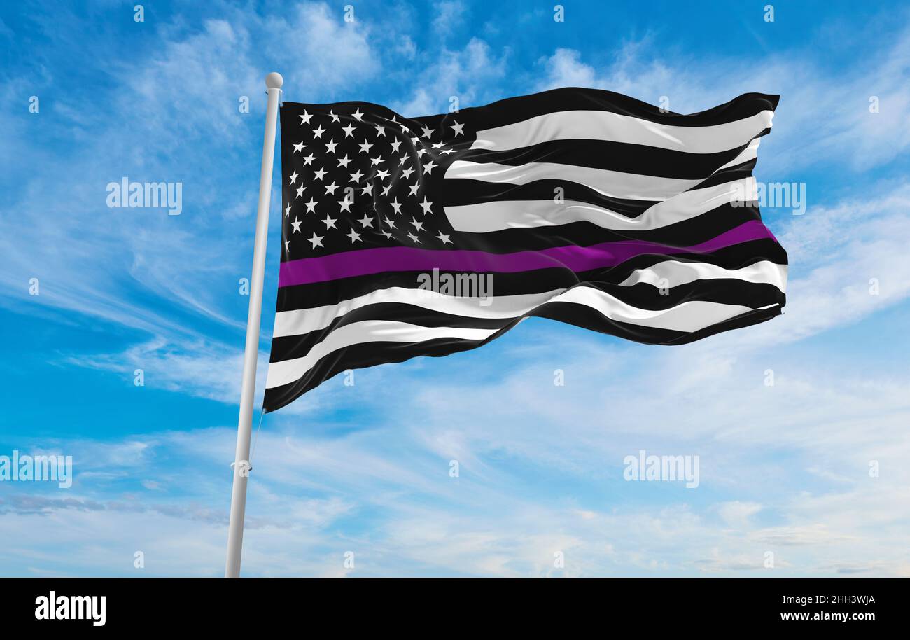 Thin Purple Line USA flag waving at cloudy sky background on sunset ...