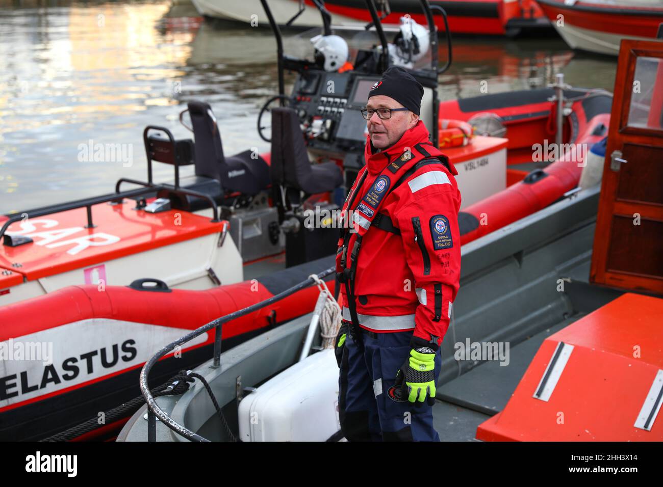 The Lifeguard stands in front of a Lifeboat.Volunteer lifeguards honor ...