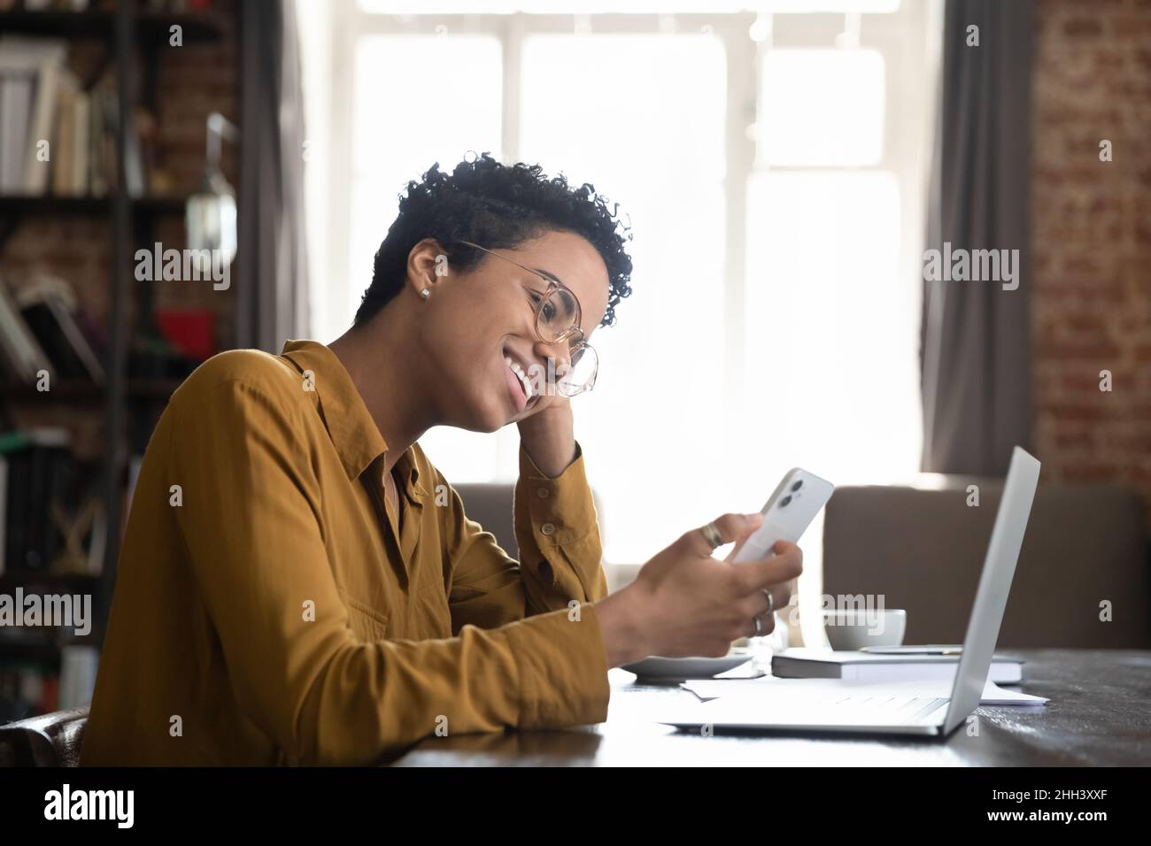 Happy African millennial gadget user girl making video call Stock Photo ...