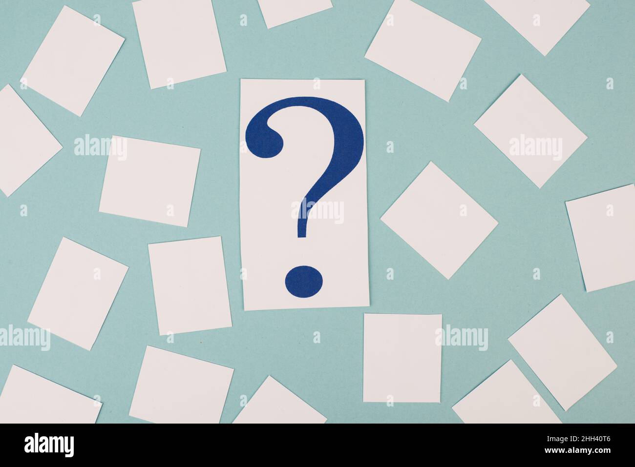 Paper with a question mark in the middle, small empty stickers around ...