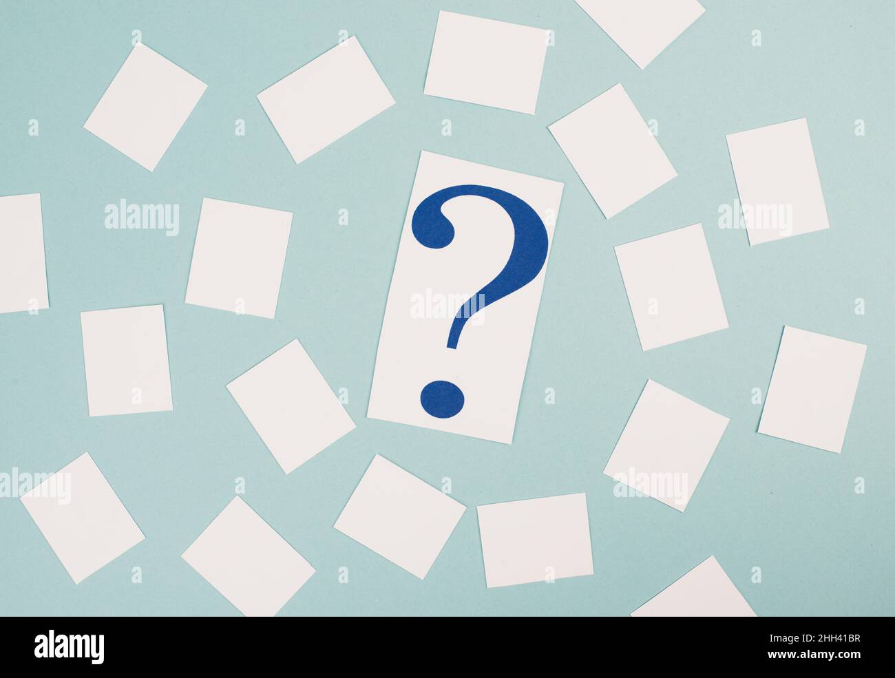 Paper with a question mark in the middle, small empty stickers around ...