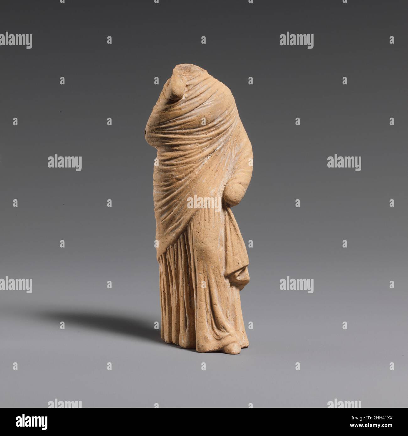 Terracotta statuette of a woman 4th century B.C. Greek Draped, standing ...