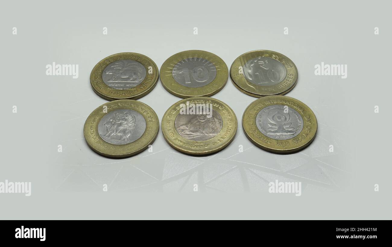 indian six deferent types of ten rupees coin. with white background ...