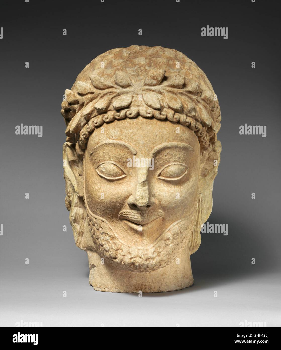 Limestone male head late 6th century B.C. Cypriot While the foliate ...