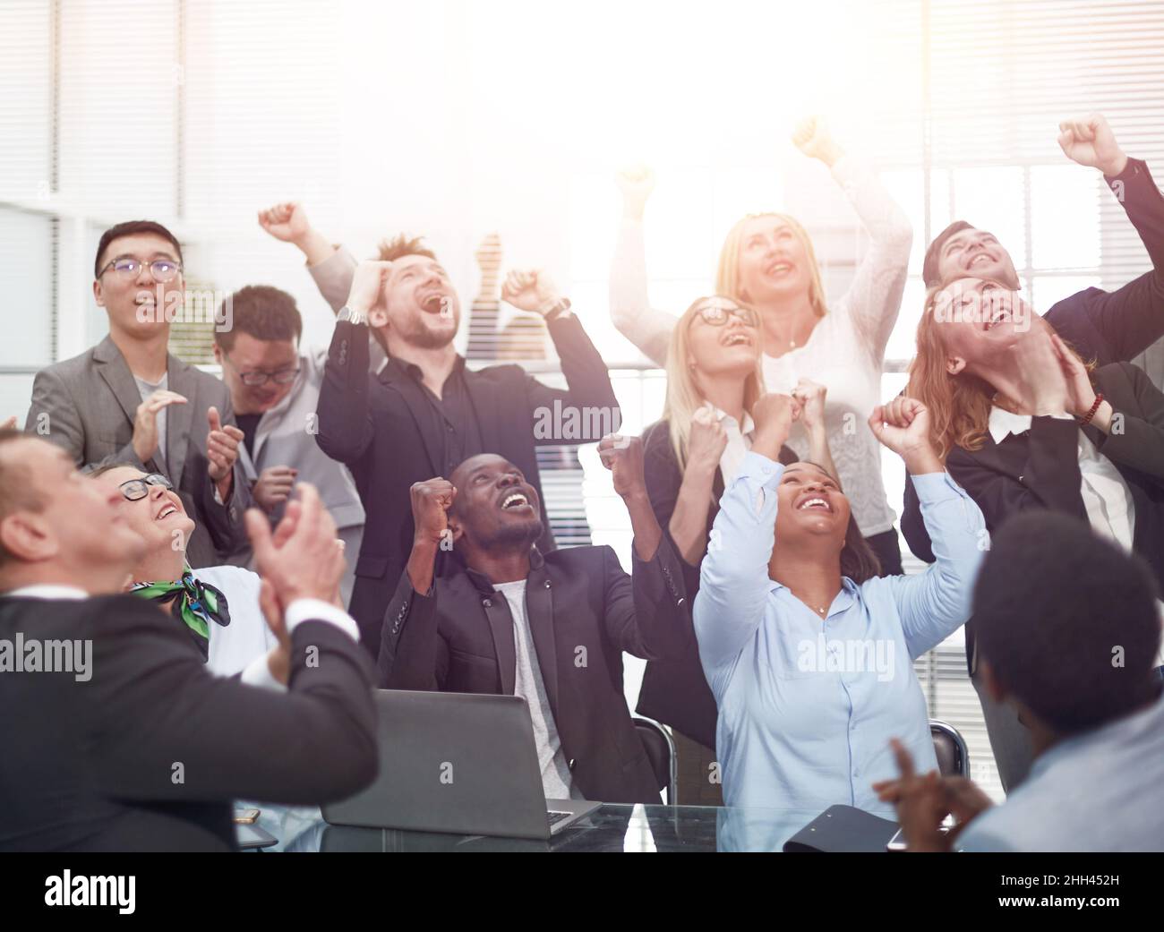 Large business team showing unity with their hands together Stock Photo ...