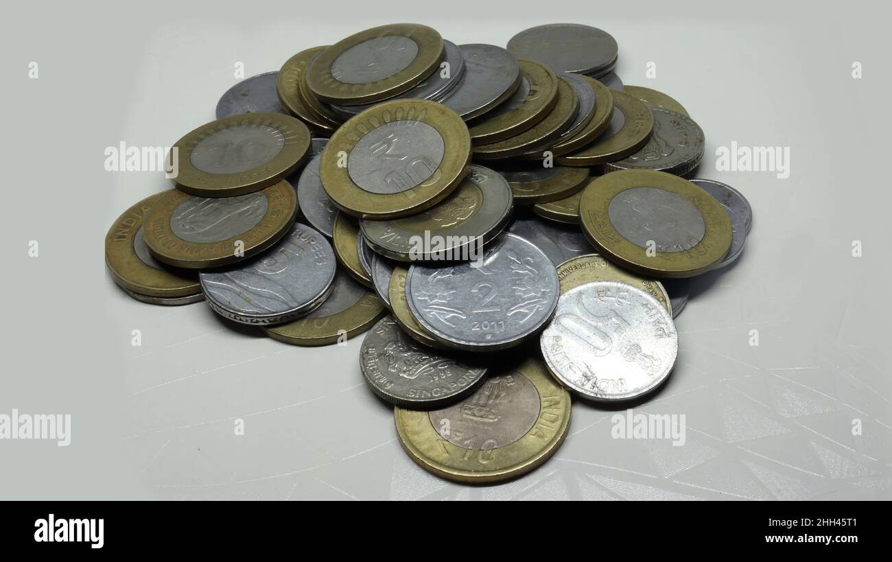 Pile of Indian Rupee Coins. On a white background Stock Photo - Alamy
