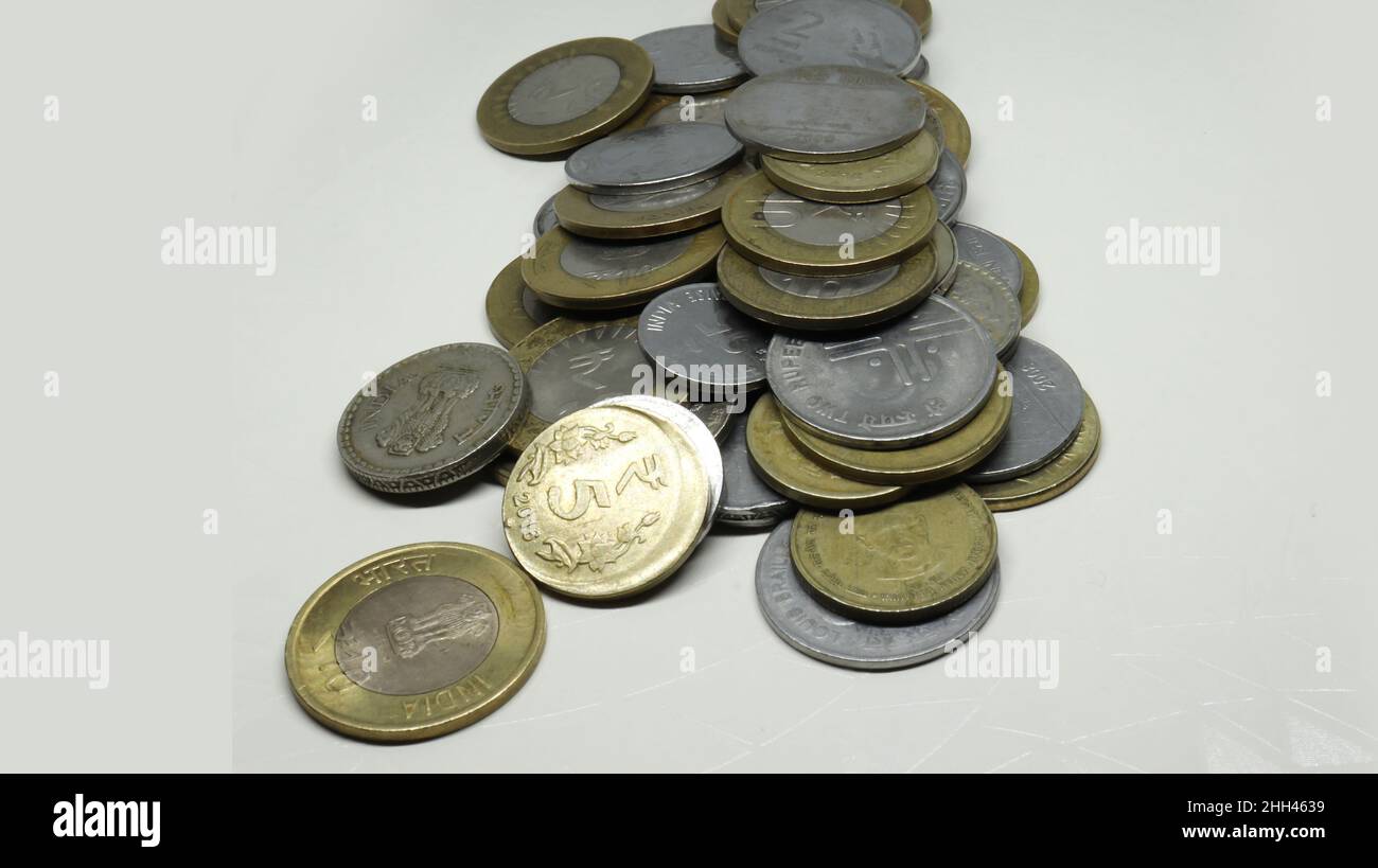 Pile of Indian Rupee Coins. On a white background Stock Photo - Alamy