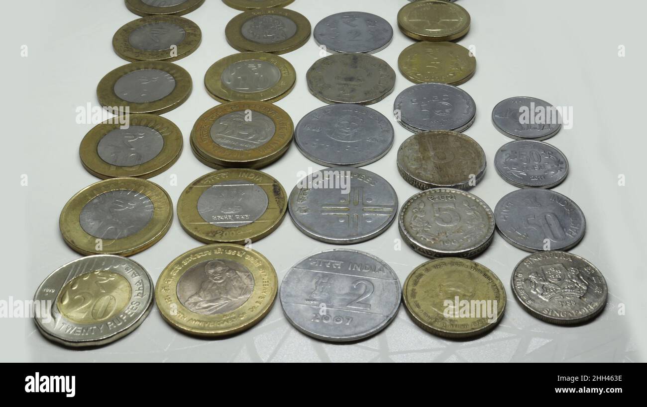 Pile of Indian Rupee Coins. On a white background Stock Photo - Alamy
