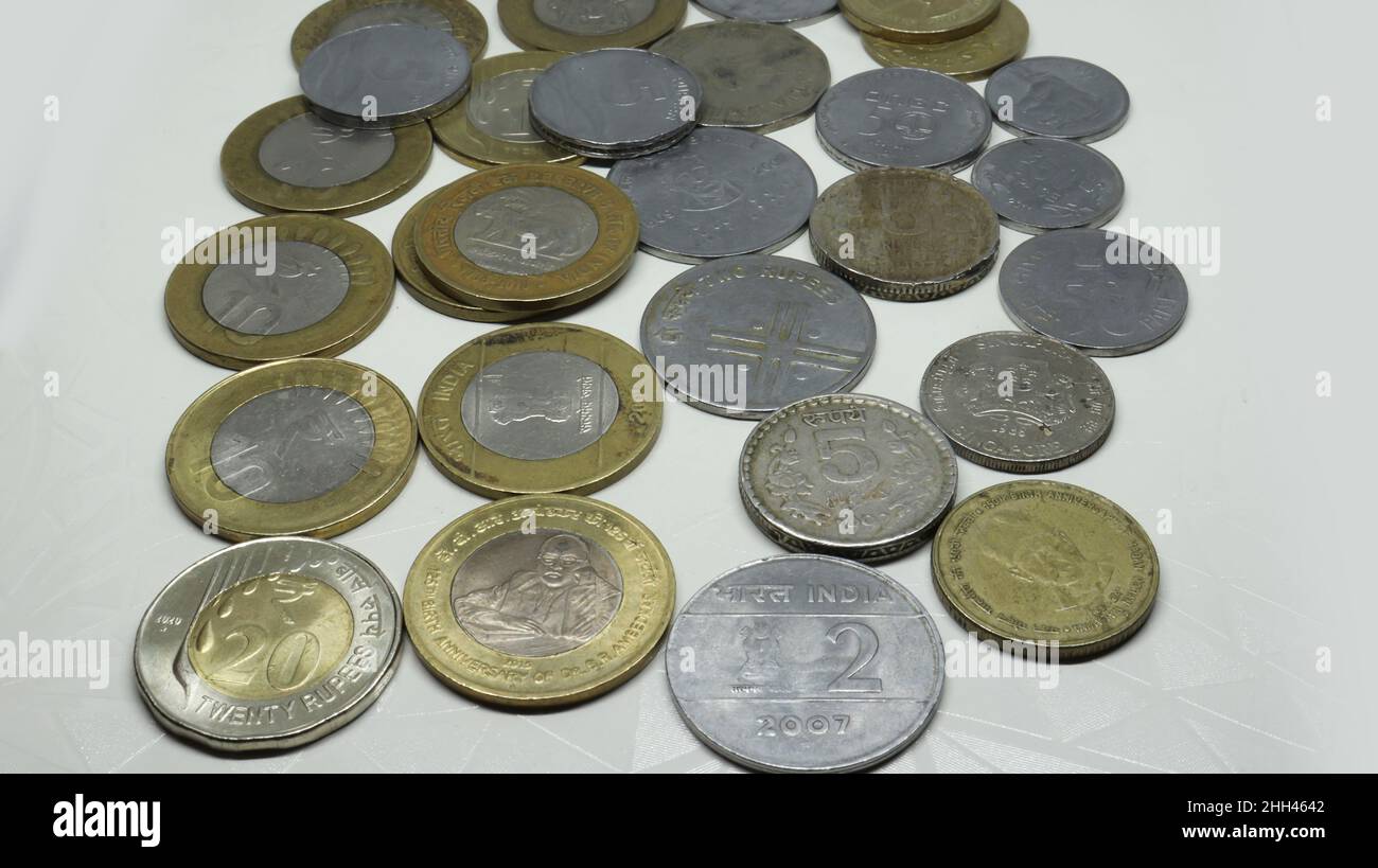 Pile of Indian Rupee Coins. On a white background Stock Photo - Alamy