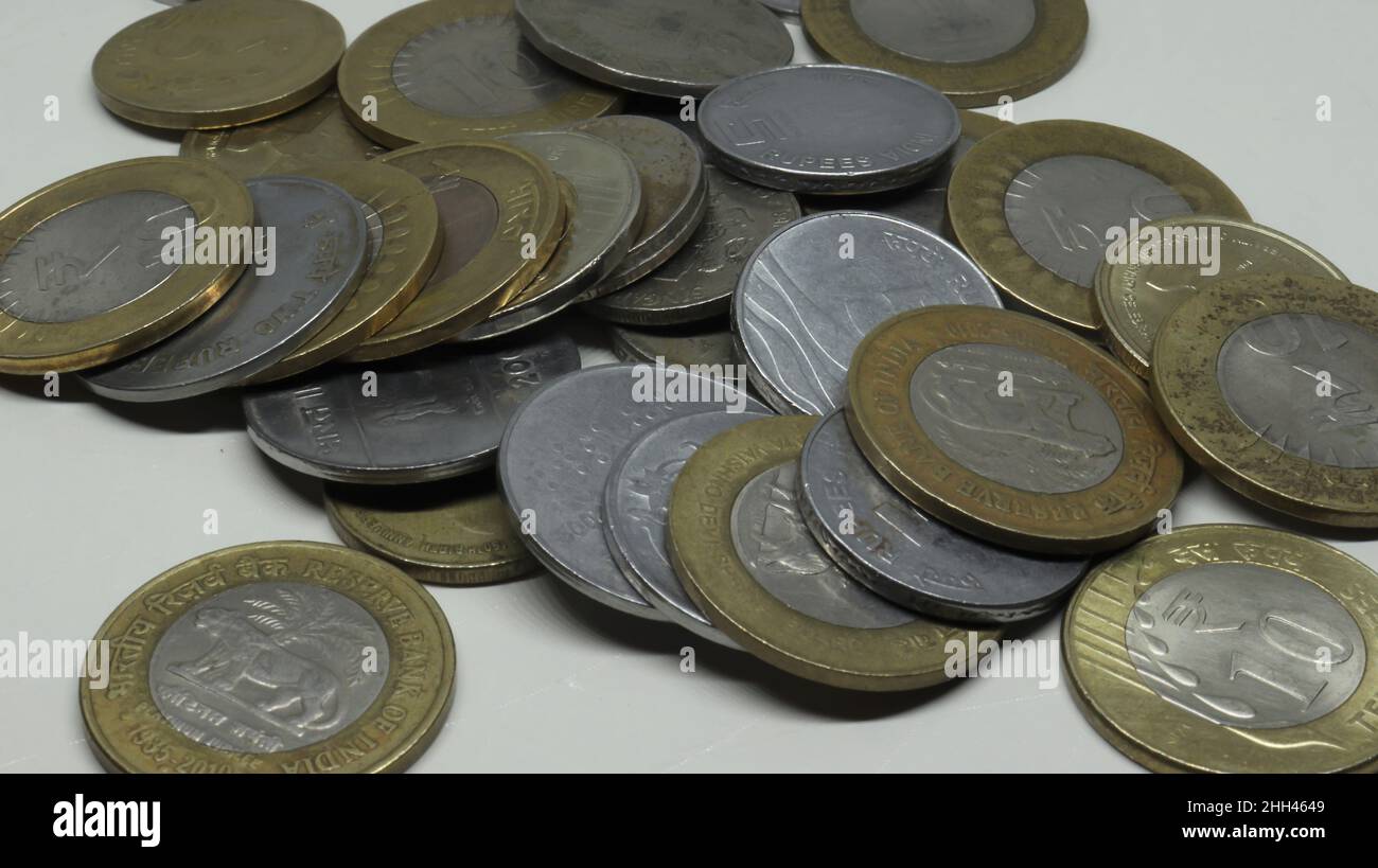 Pile of Indian Rupee Coins. On a white background Stock Photo - Alamy