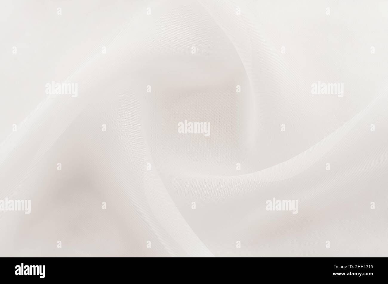 White fabric. The texture of the material, chintz or satin in a light ...