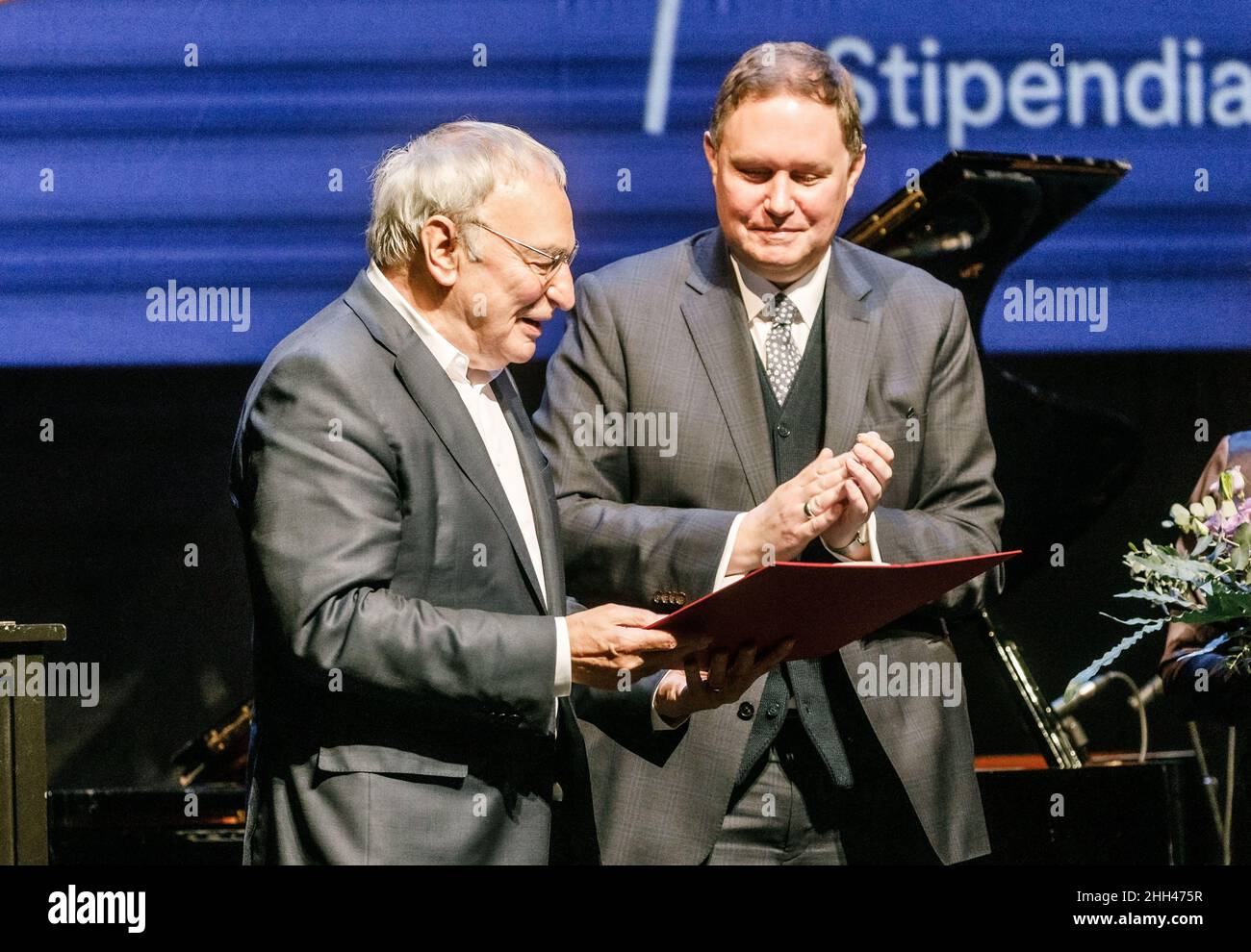 Hamburg, Germany. 23rd Jan, 2022. Author Uwe Timm (l) shows off the ...