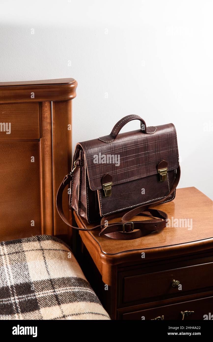 Brown leather briefcase with two locks. hotel room photo Stock Photo ...