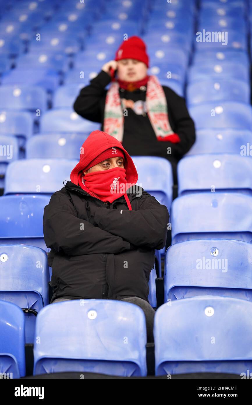 Liverpool fans wrapped up against the cold in the stands during the ...