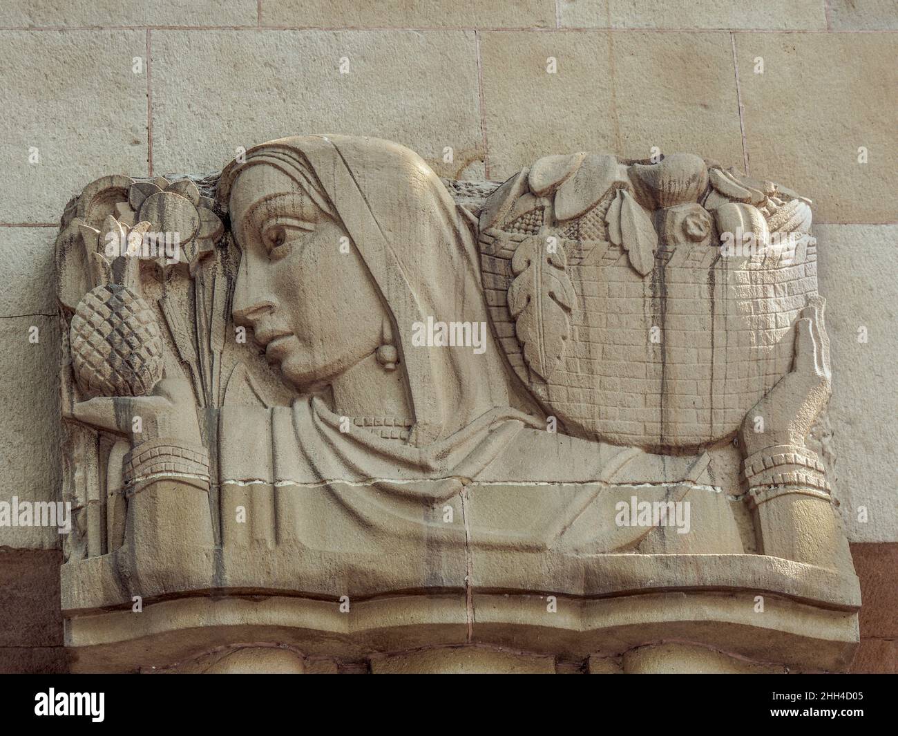12 17 2021 Art Deco bas relief sculpture showing a woman carrying a ...