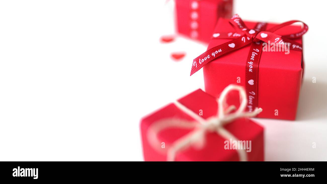 Red gift boxes for Valentines day on white background Stock Photo - Alamy