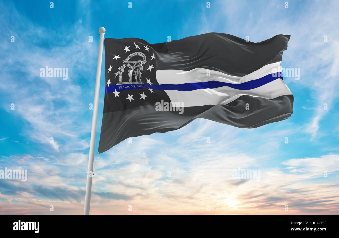 blue line flag of Georgia state, Usa at cloudy sky background on sunset ...