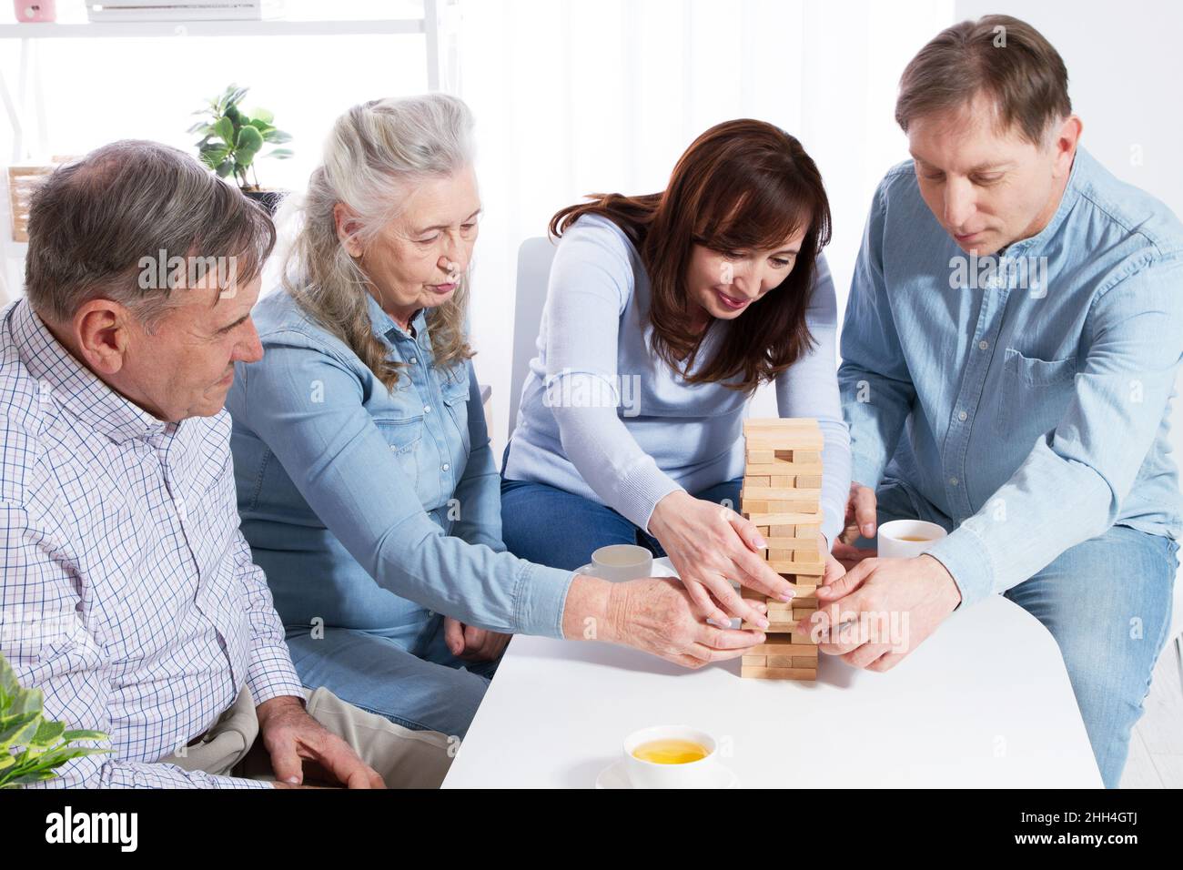 Elderly couple and elderly couple collect wooden blocks at home Stock ...
