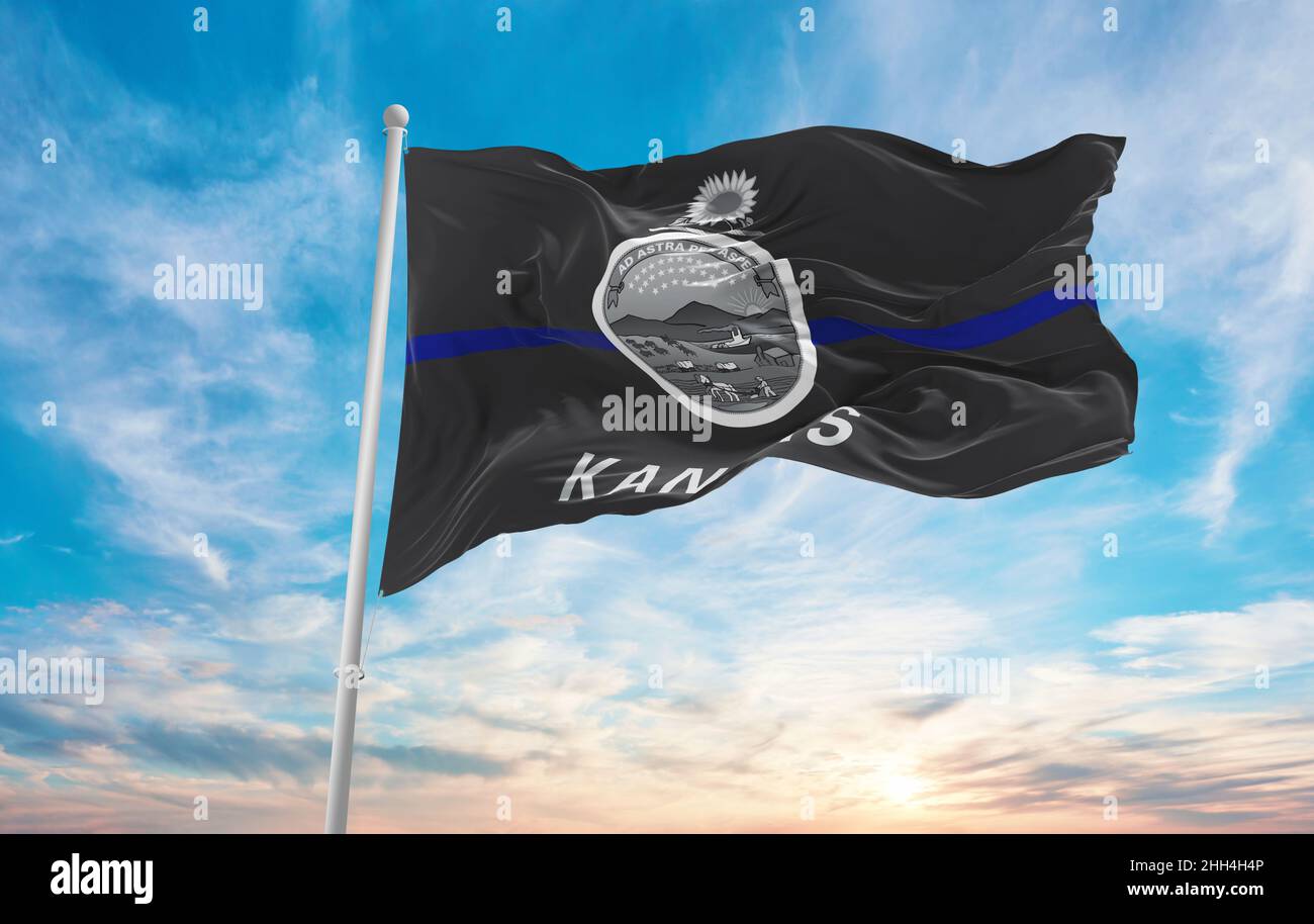 blue line flag of Kansas state, Usa at cloudy sky background on sunset ...