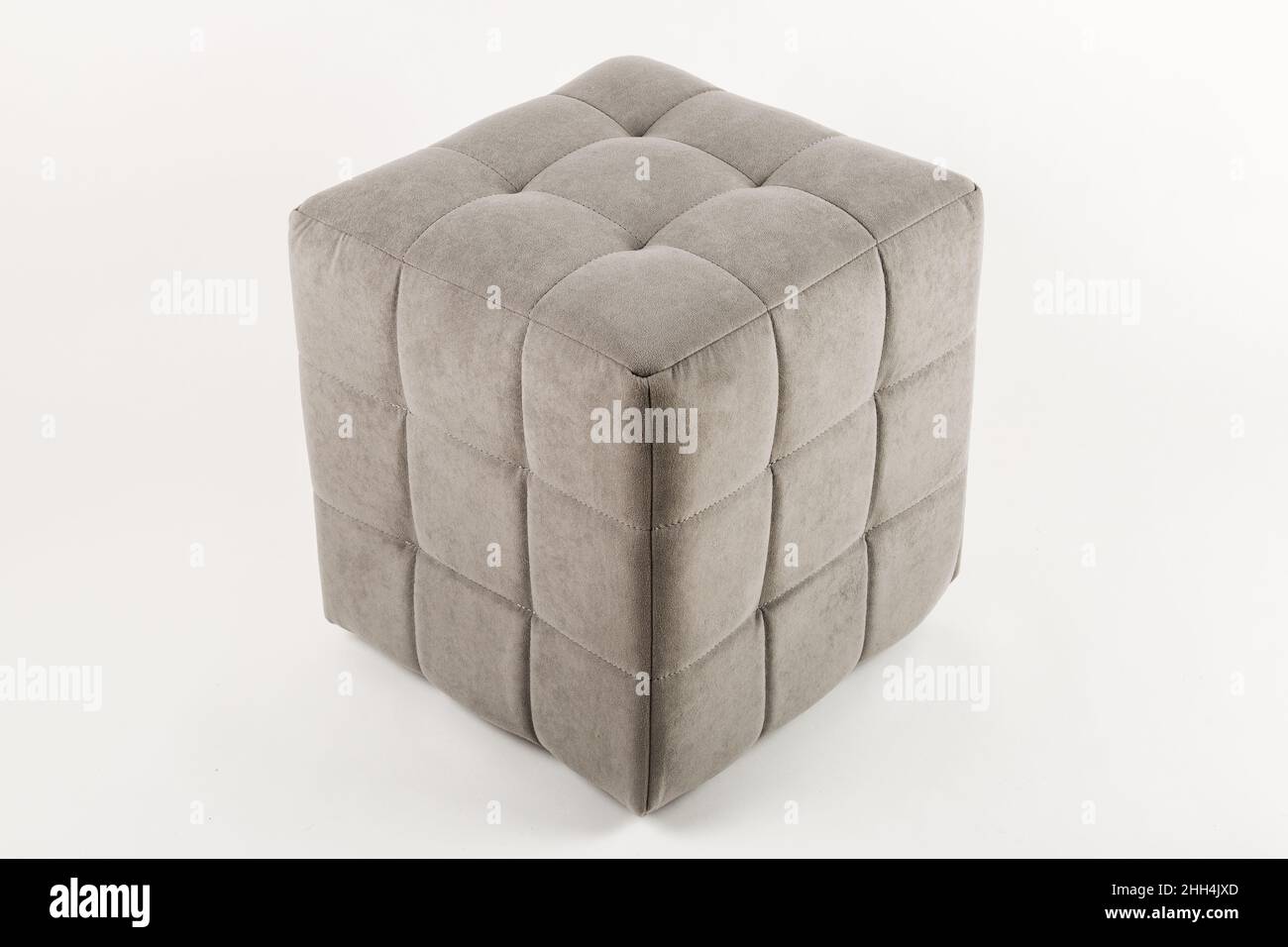 Soft beige pouf on a white background Stock Photo - Alamy