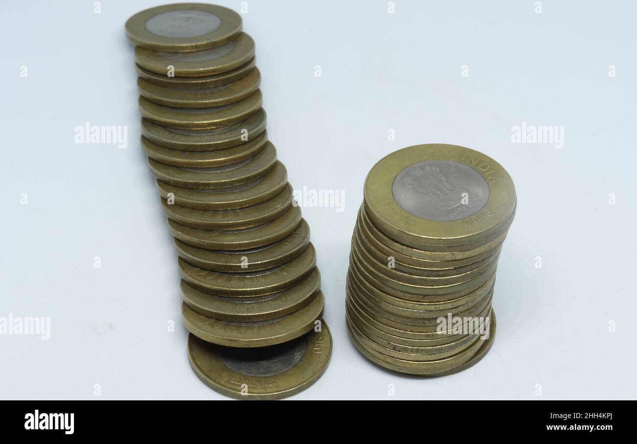 Pile of Indian Rupees Coins. Ten rupees coins. On a white background ...