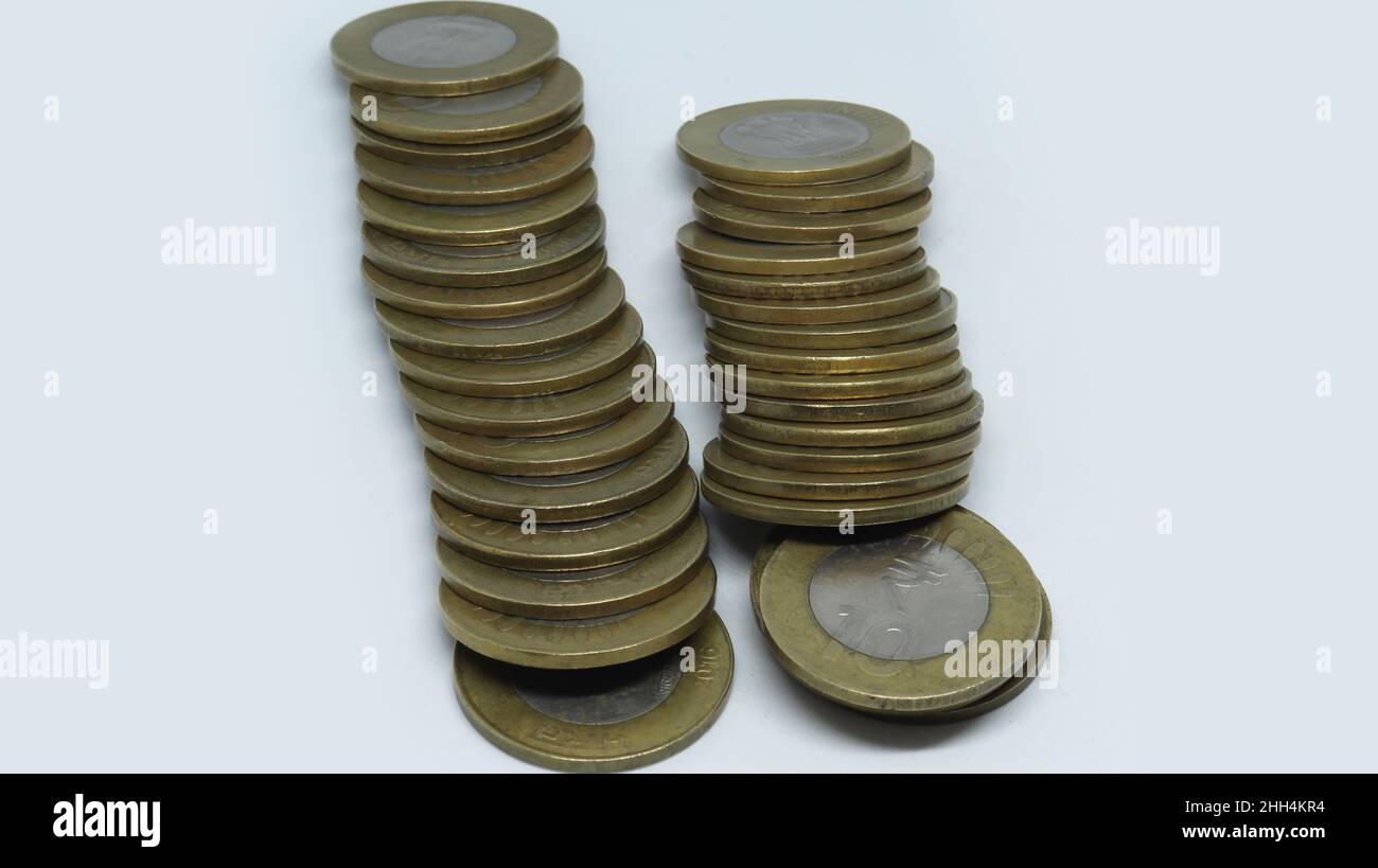 Pile of Indian Rupees Coins. Ten rupees coins. On a white background ...