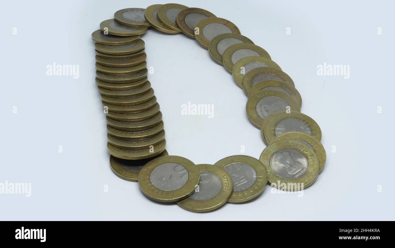 Pile of Indian Rupees Coins. Ten rupees coins. On a white background ...