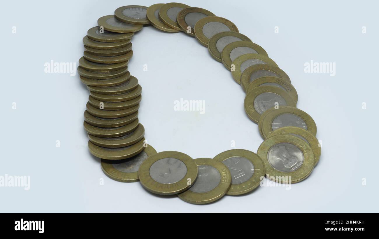 Pile of Indian Rupees Coins. Ten rupees coins. On a white background ...